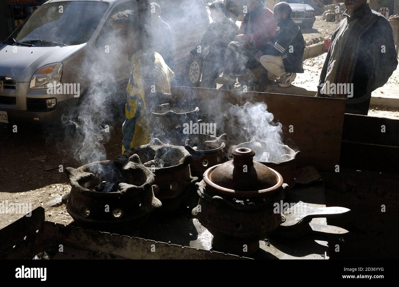 Cooking with tanjines on the roadside in the village of Imlil,Atlas ...