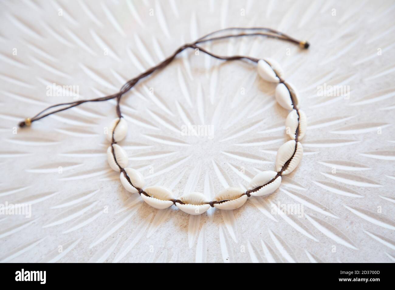 White shell choker necklace on white background Stock Photo - Alamy
