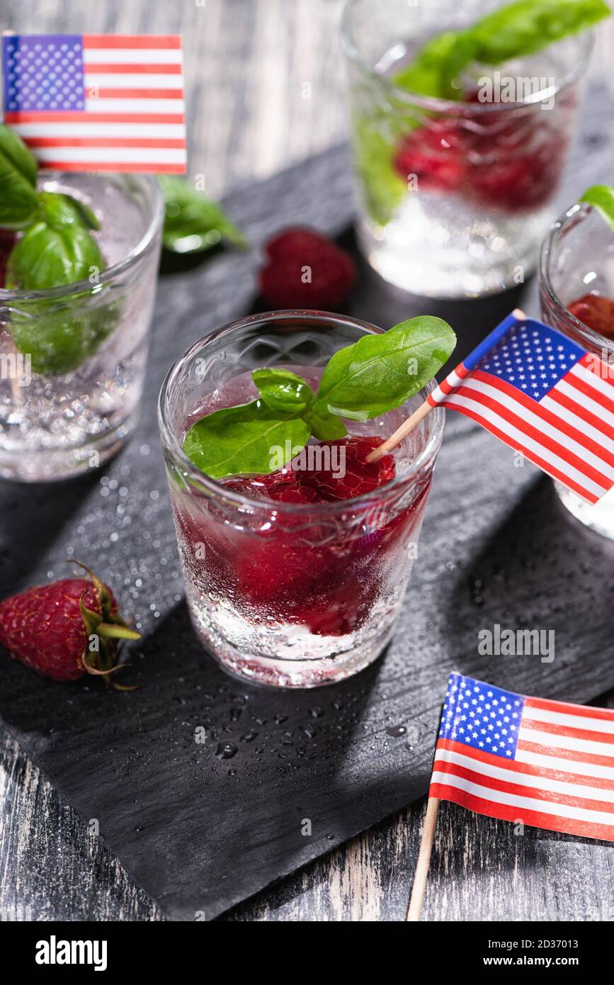 Alcohol shots of berries cocktail with a raspberry Stock Photo - Alamy