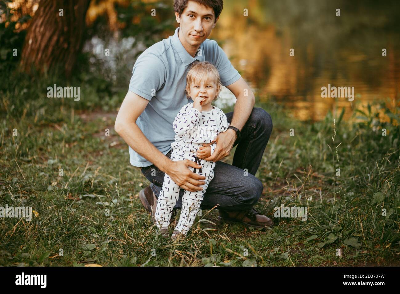happy family father and son walking in nature Stock Photo - Alamy