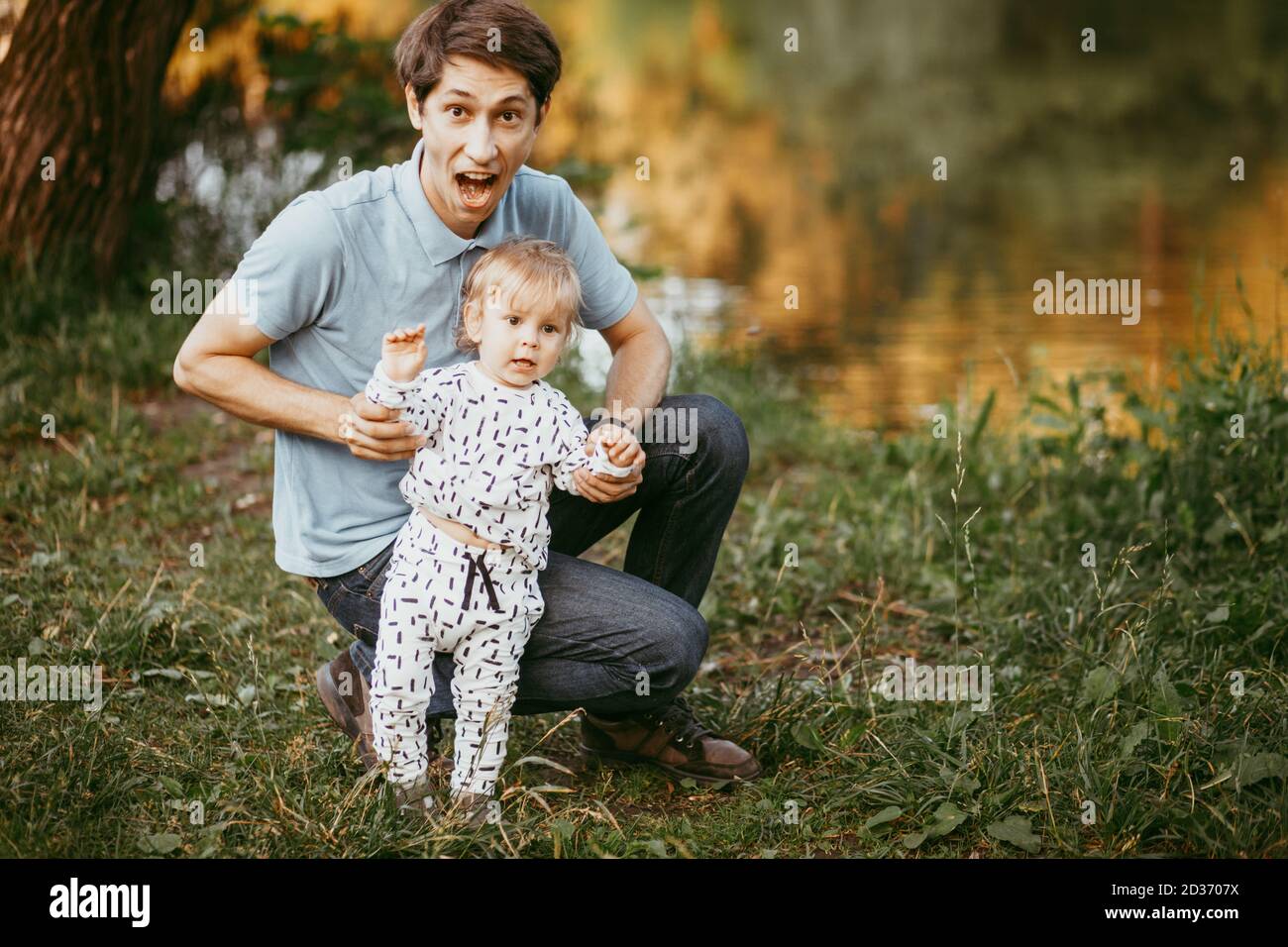 happy family father and son walking in nature Stock Photo - Alamy