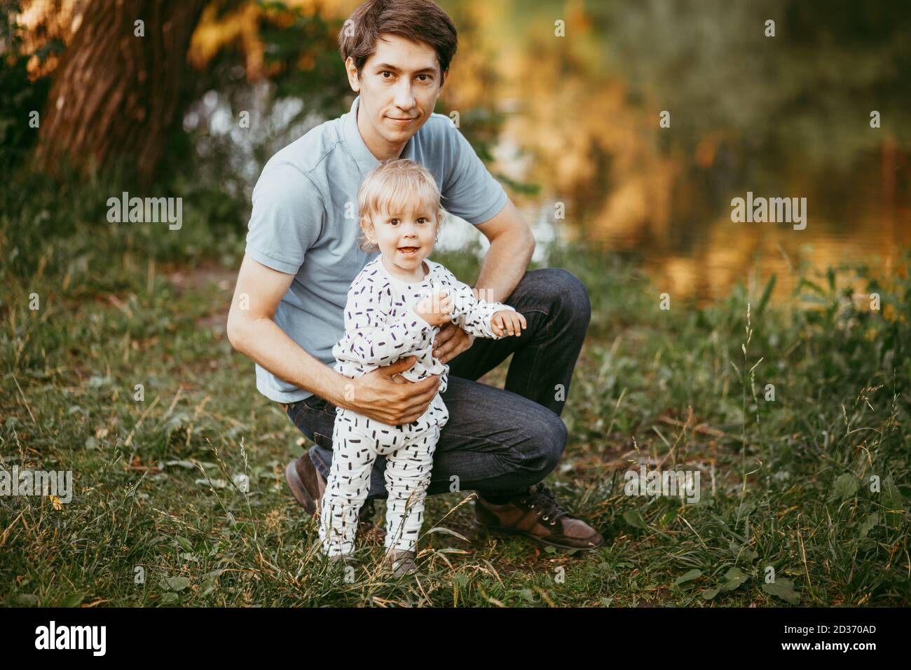 happy family father and son walking in nature Stock Photo - Alamy