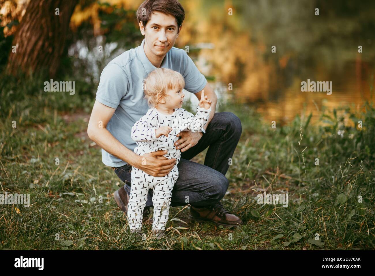 happy family father and son walking in nature Stock Photo - Alamy
