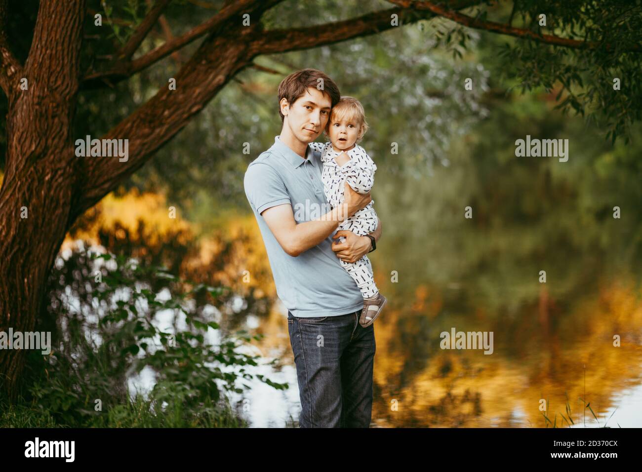 happy family father and son walking in nature Stock Photo - Alamy