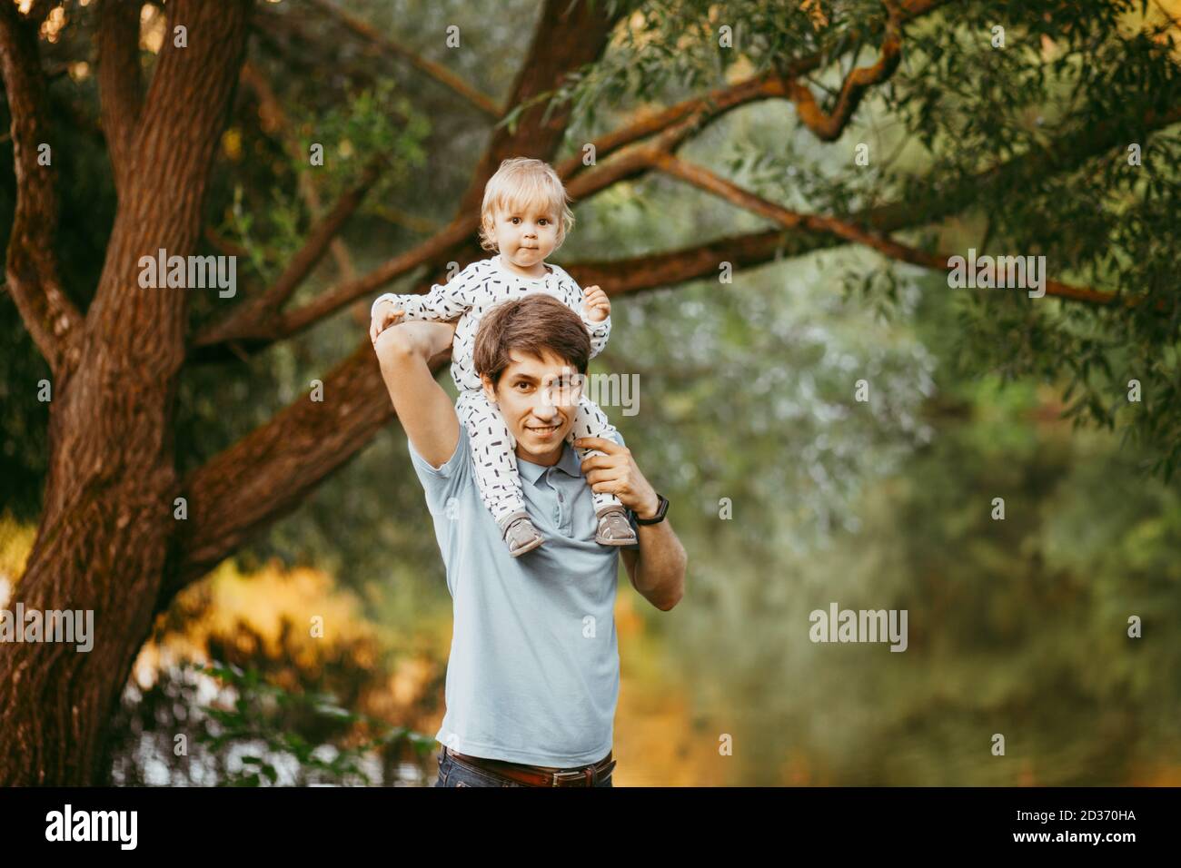 happy family father and son walking in nature Stock Photo - Alamy