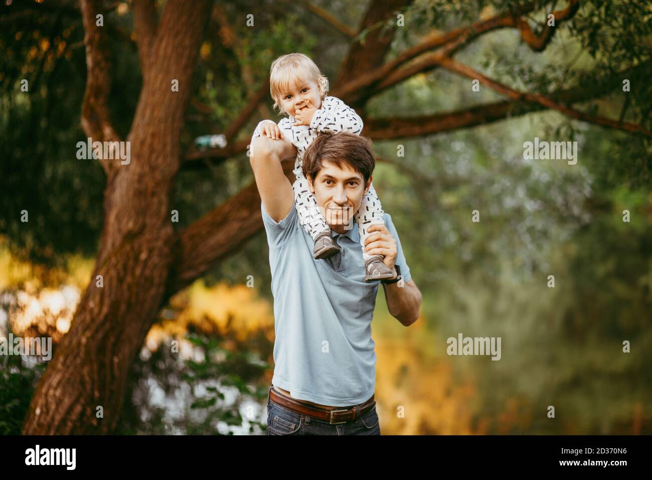 happy family father and son walking in nature Stock Photo - Alamy