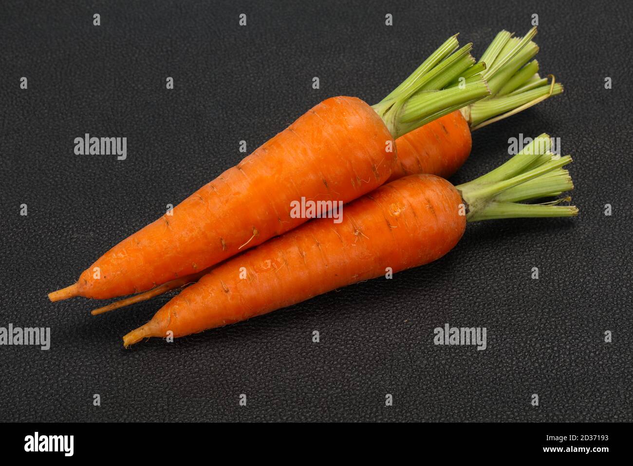 Three Young fresh ripe carrots Stock Photo - Alamy