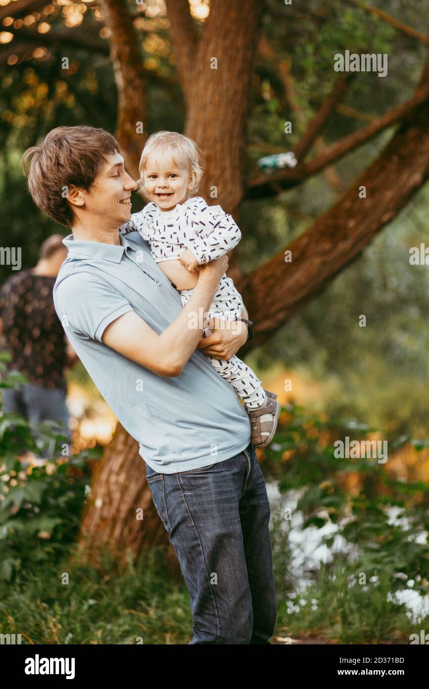 happy family father and son walking in nature Stock Photo - Alamy