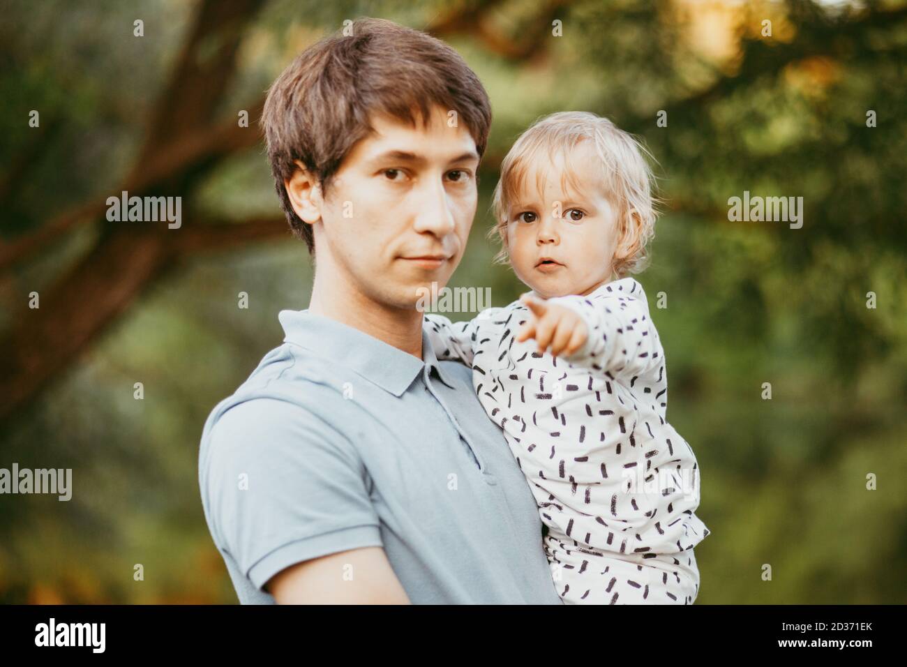 happy family father and son walking in nature Stock Photo - Alamy
