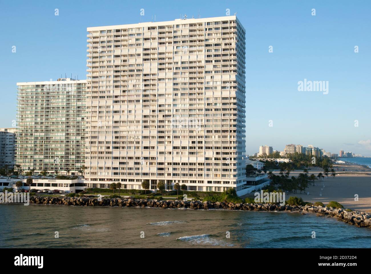 The evening view of tall residential buildings built on a beach in Fort ...