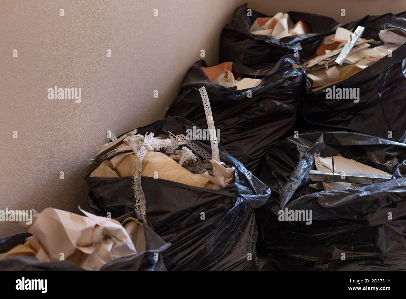 black plastic bags full of construction waste Stock Photo - Alamy