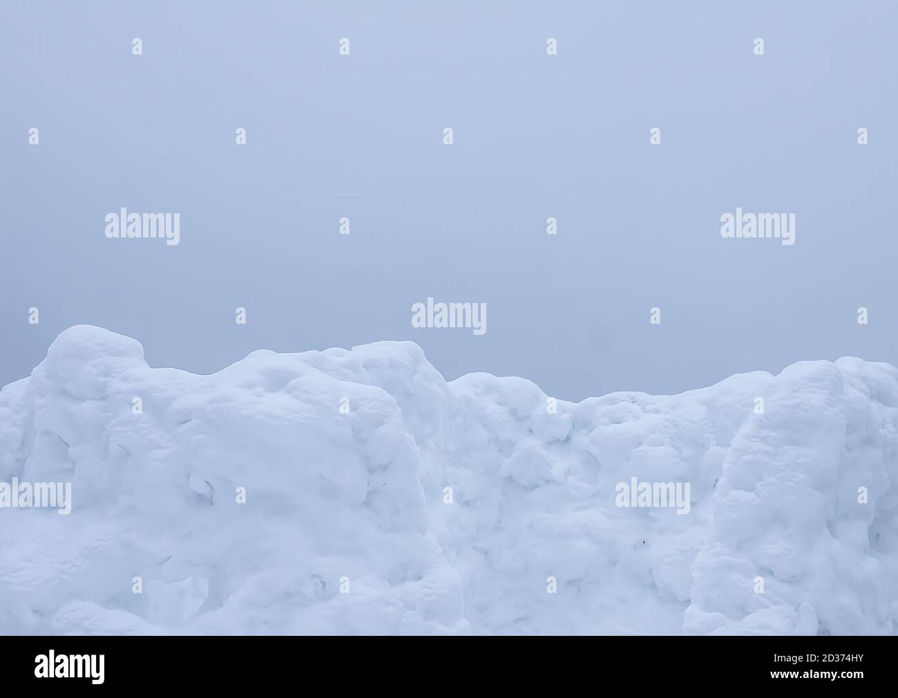 Wall made of snow on rural field Stock Photo - Alamy