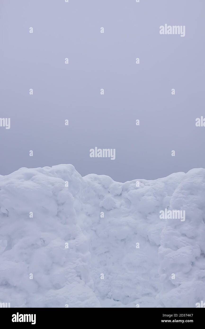 Wall made of snow on rural field Stock Photo - Alamy