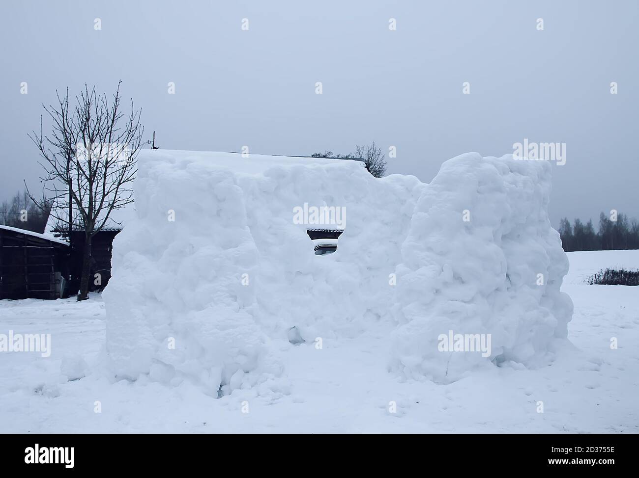 Wall made of snow on rural field Stock Photo - Alamy