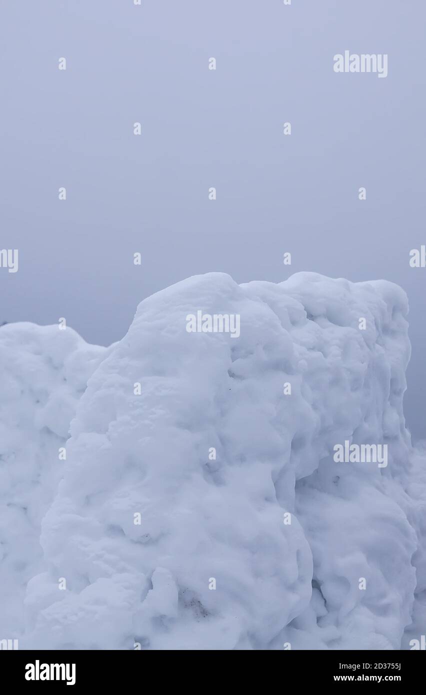 Wall made of snow on rural field Stock Photo - Alamy