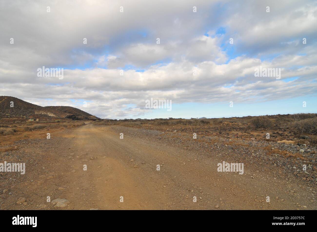 Sand and Rocks Road in the Desert Stock Photo - Alamy