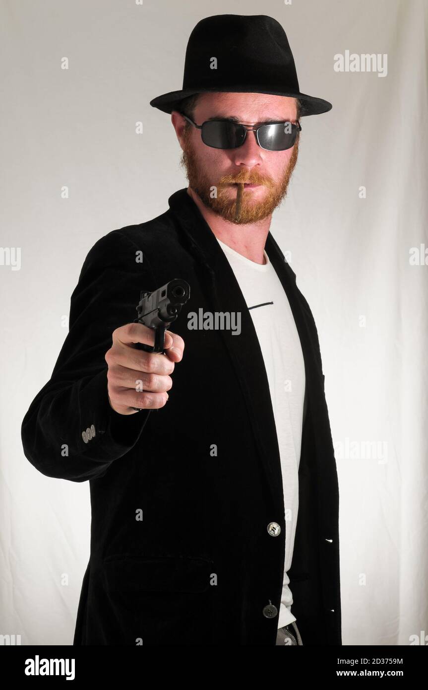 Man Holding a Pistol Gun Stock Photo - Alamy