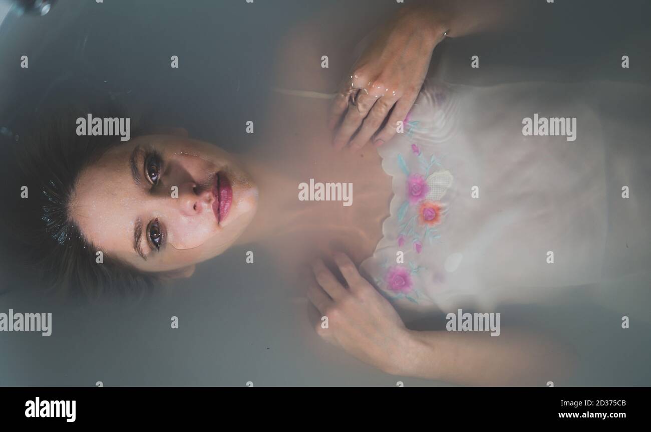 Woman floating bathtub hi-res stock photography and images - Alamy