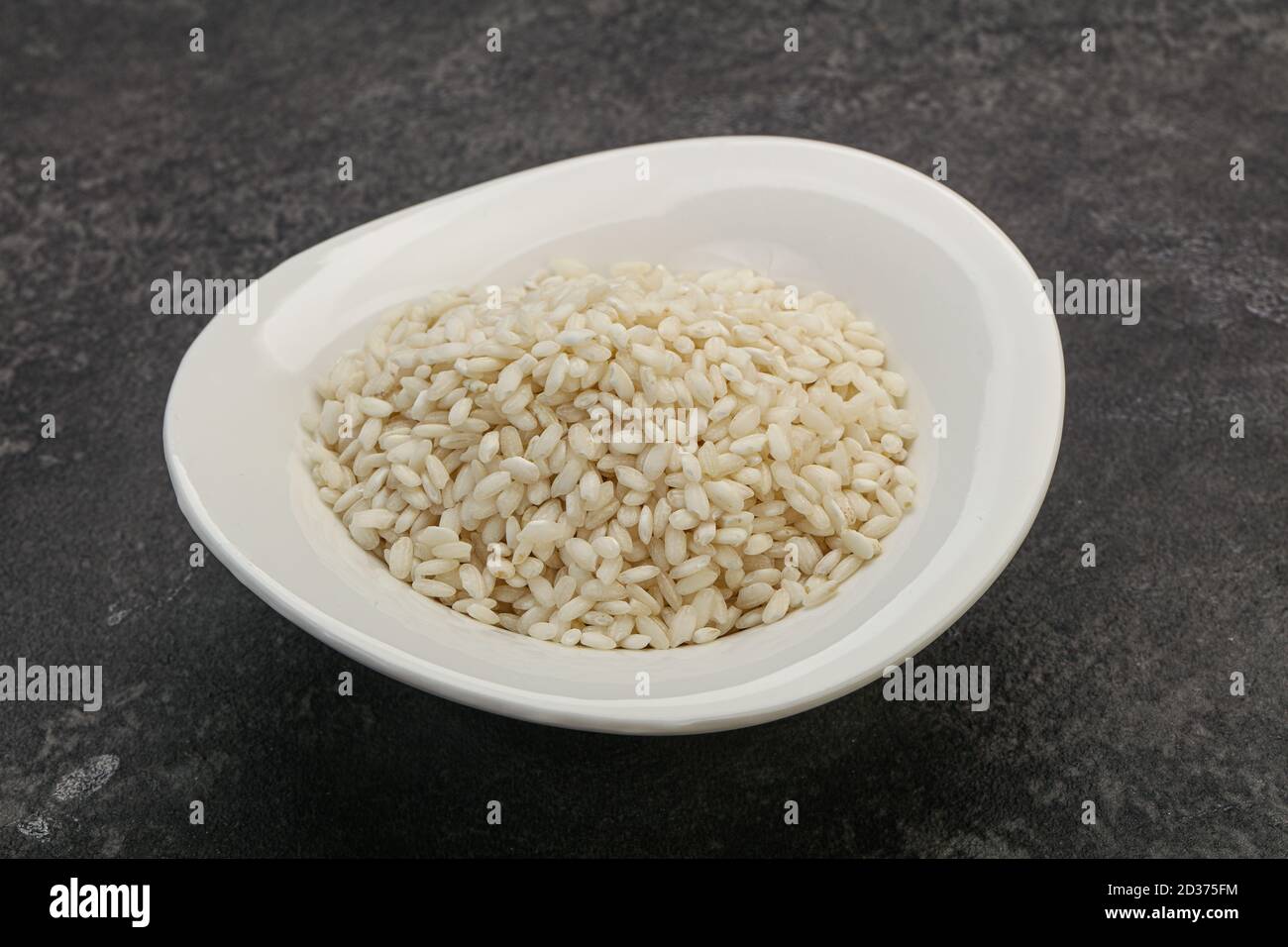 Raw Italian arborio rice for Risotto Stock Photo - Alamy