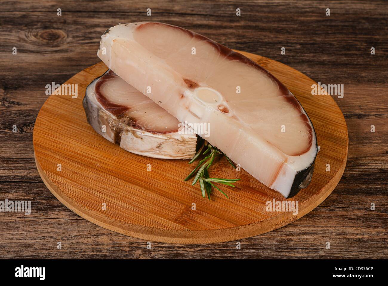 Raw shark steak served rosemary for cooking Stock Photo - Alamy