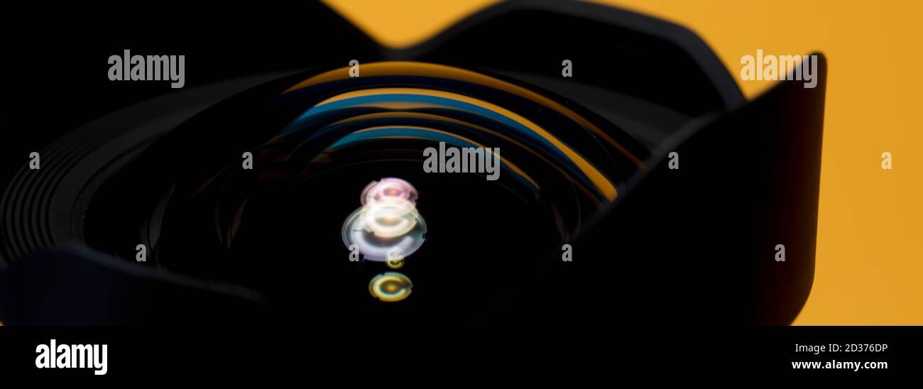 Optical partial sight. Reflection in the photo, camera on orange ...