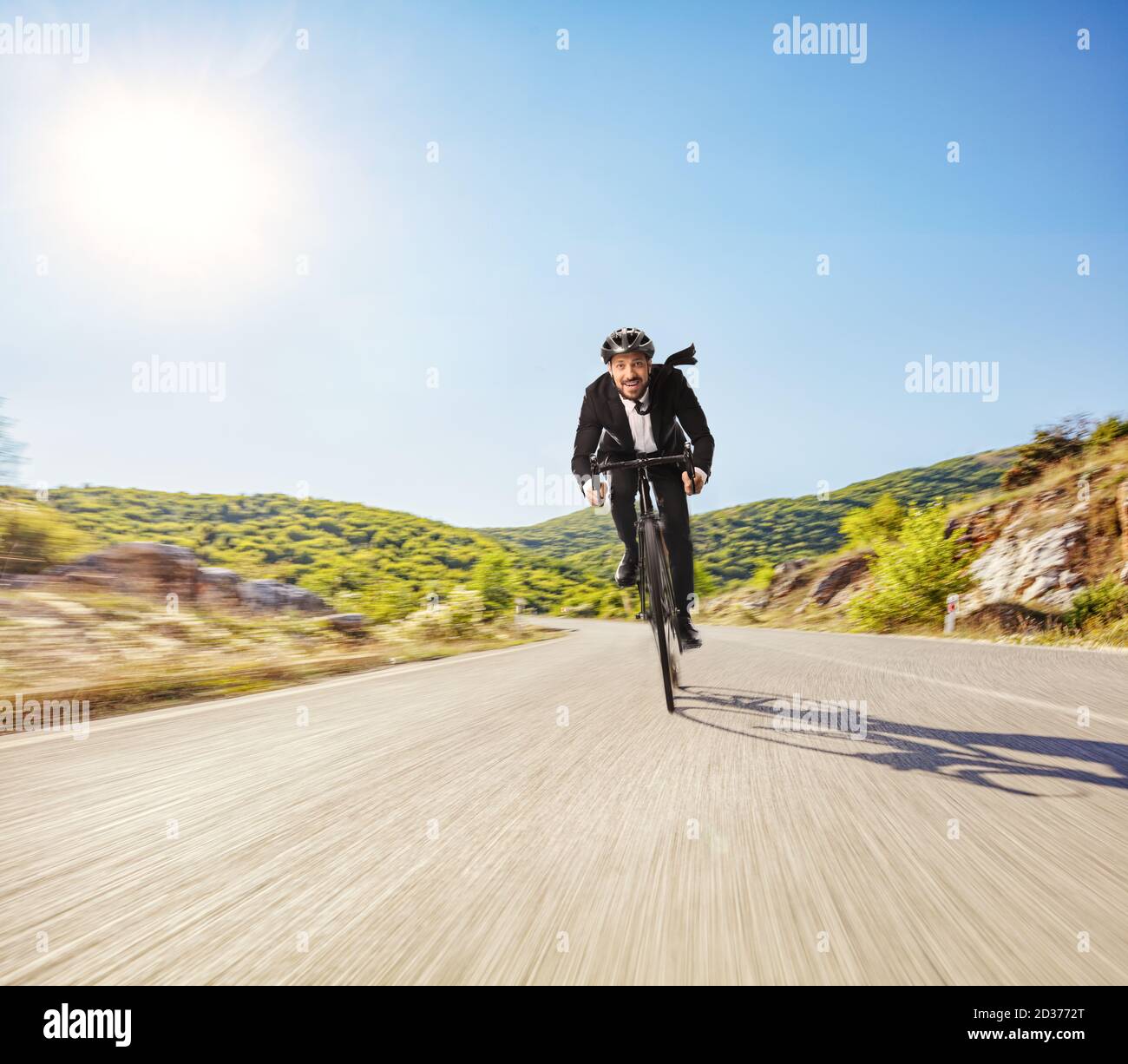 Biking in a suit hi-res stock photography and images - Alamy