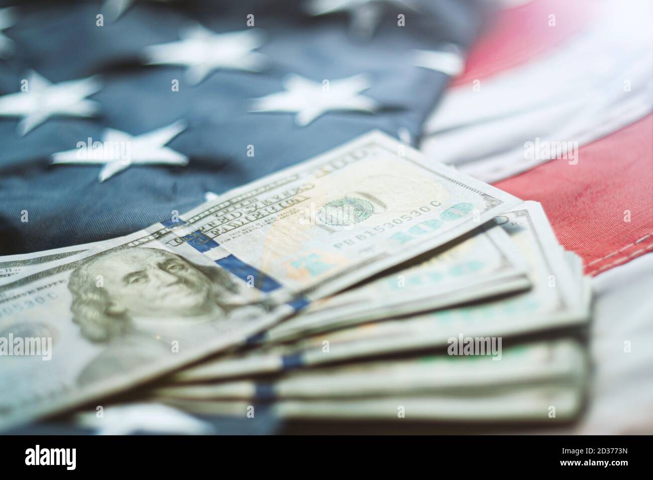 American dollars banknotes on the flag of United States of America. US ...