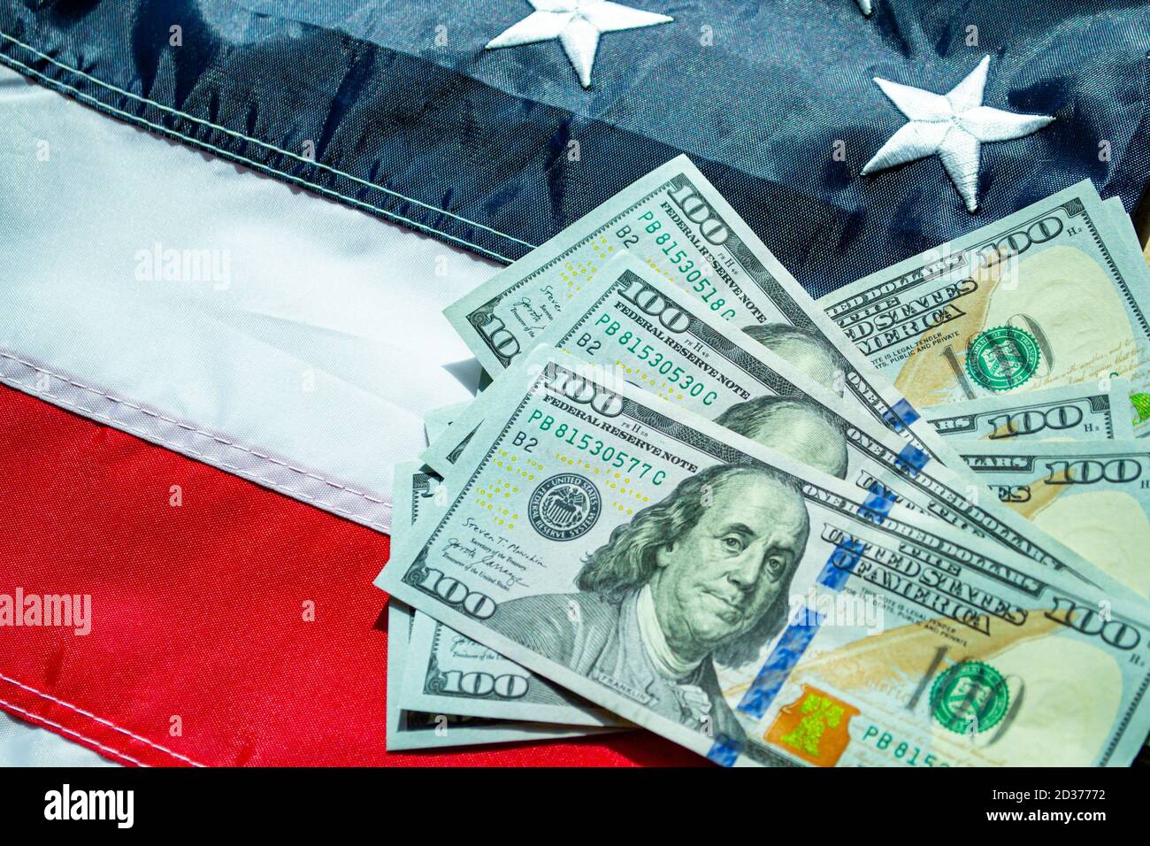 American dollars banknotes on the flag of United States of America. US ...