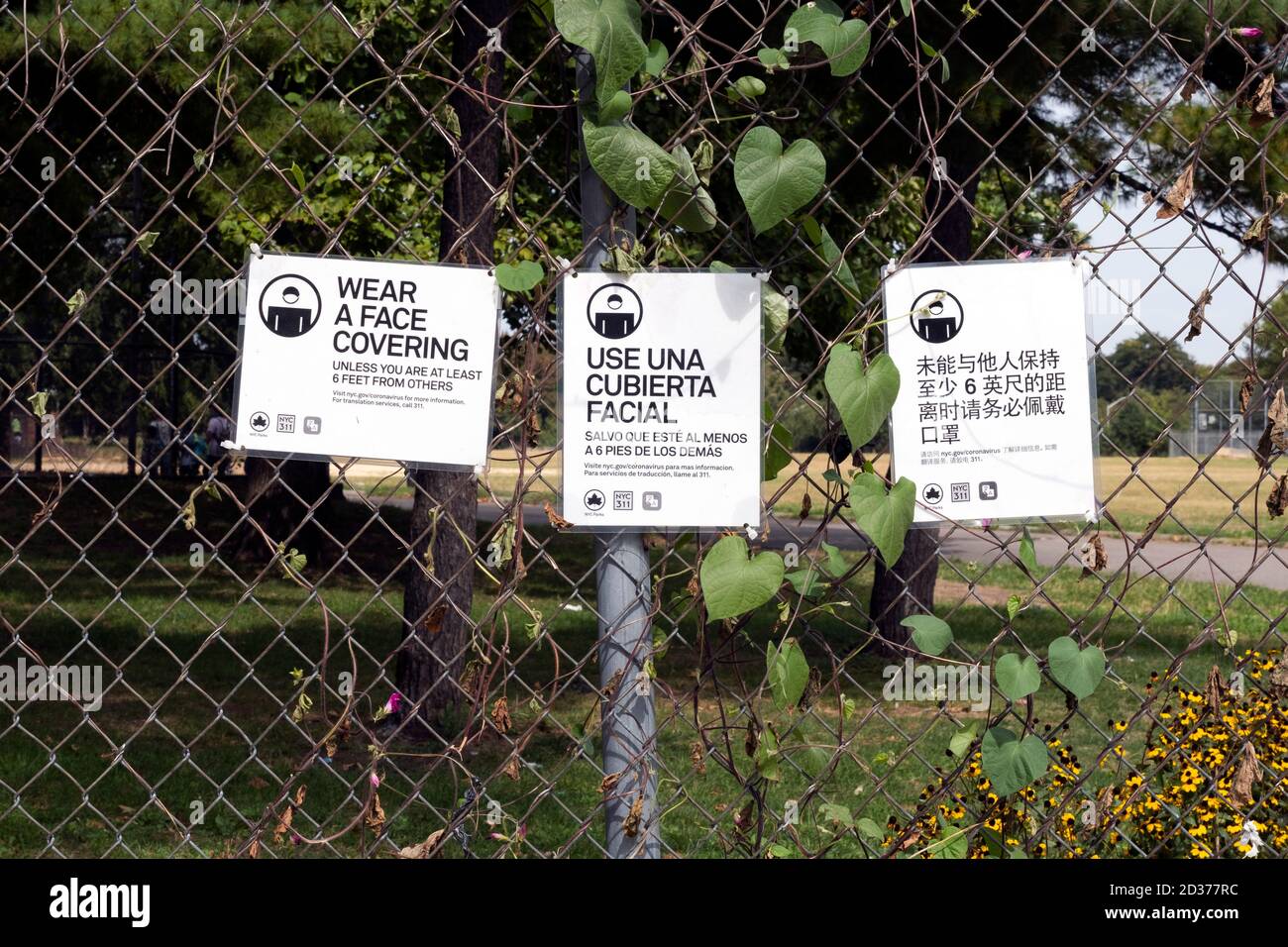 English, Spanish & Korean signs about the rules for wearing face ...