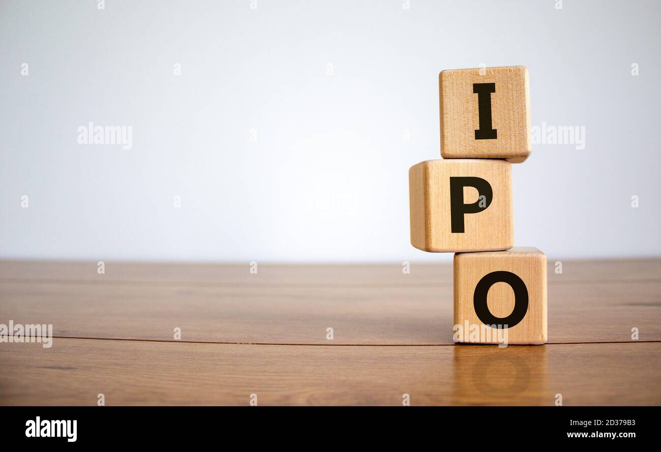 Concept word 'IPO' - 'initial public offering' on wooden cubes on a ...