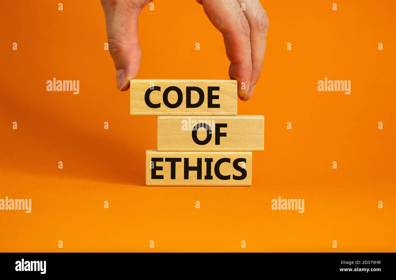 Male hand placing a blocks with word 'code' on top of a blocks tower ...