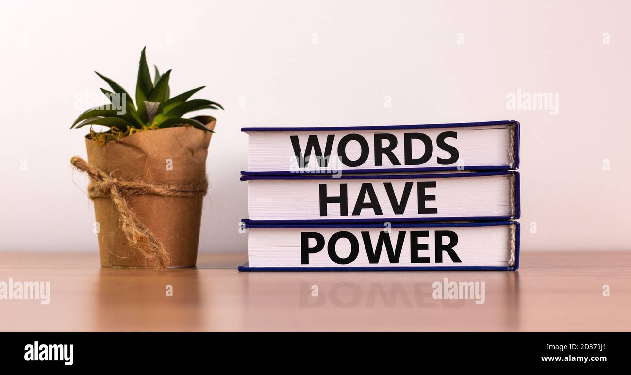 Books with text 'words have power' on beautiful wooden table. House ...