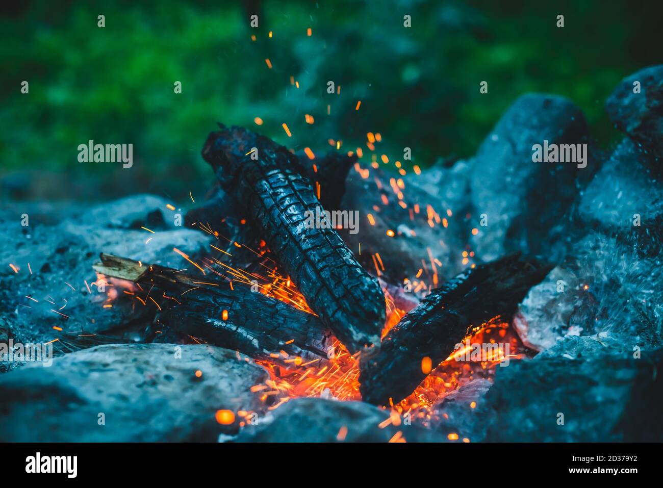 Vivid smoldered firewoods burned in fire closeup. Atmospheric ...