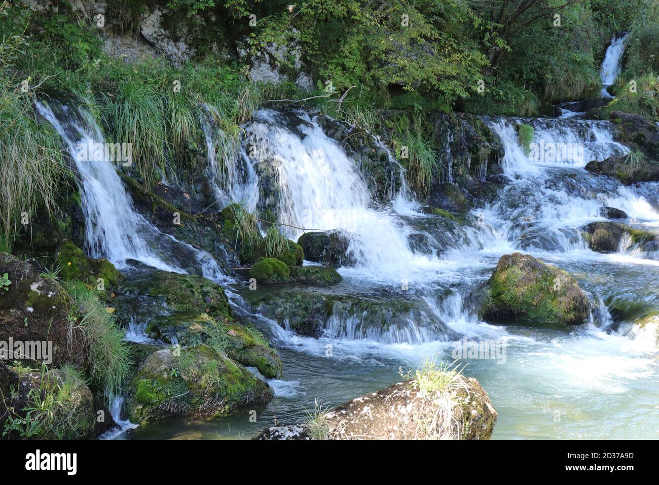Waterfall of a fast mountain river Stock Photo - Alamy