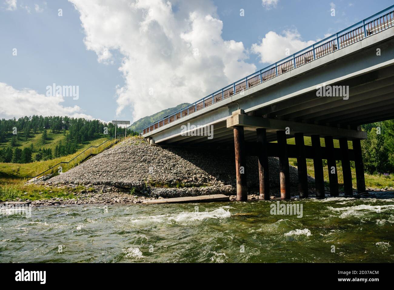 Wonderful landscape with concrete bridge over mountain small river in ...