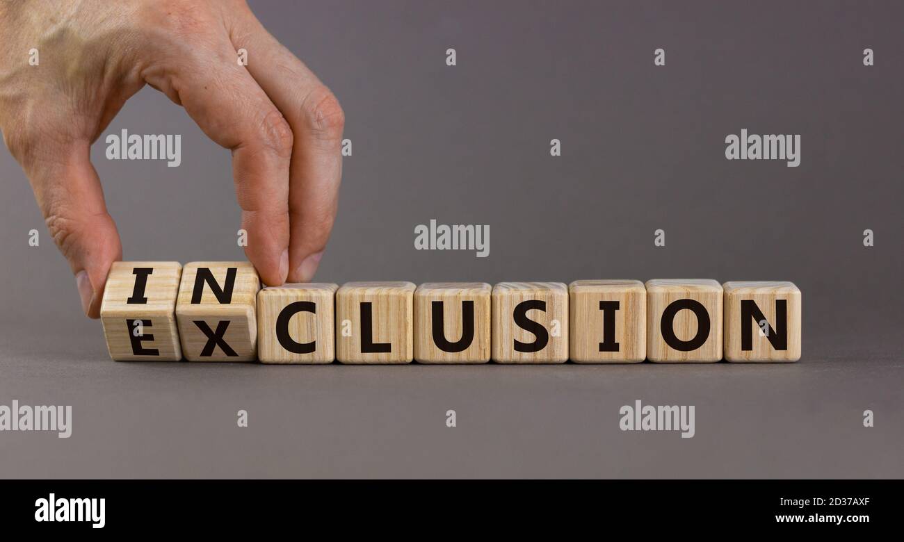 Symbol for a better inclusion. Male hand turns cubes and changes word ...