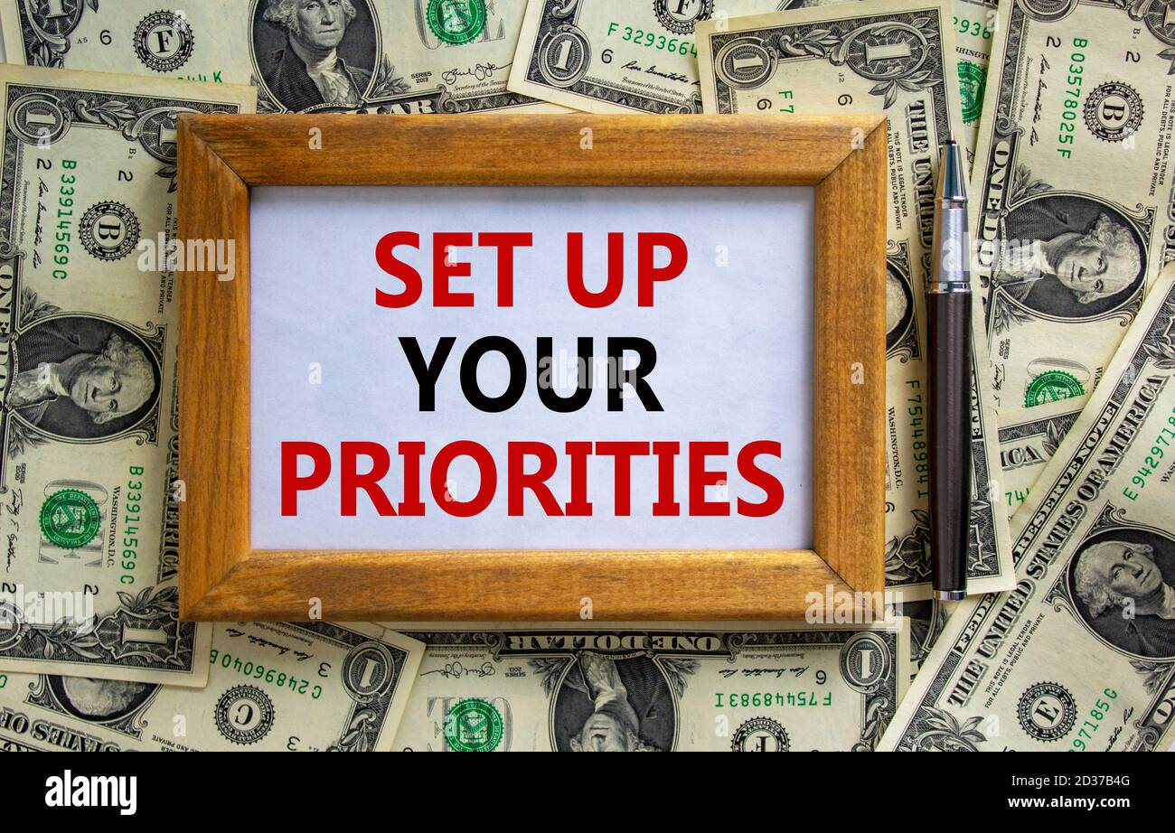 Wooden picture frame with inscription 'set up your priorities' on ...