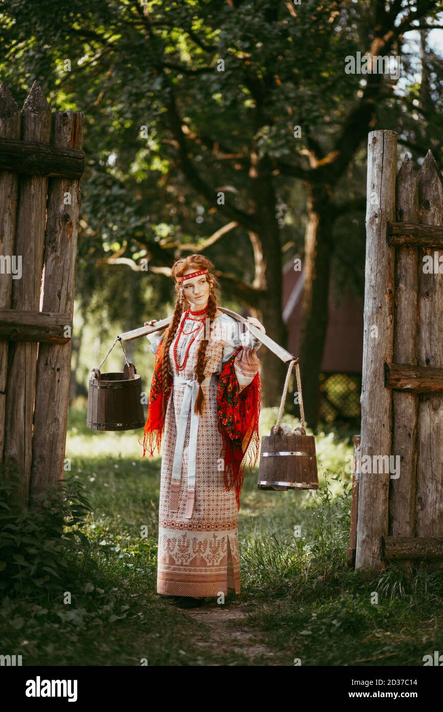 Beautiful Slavic girl with long blonde hair and brown eyes in a white ...