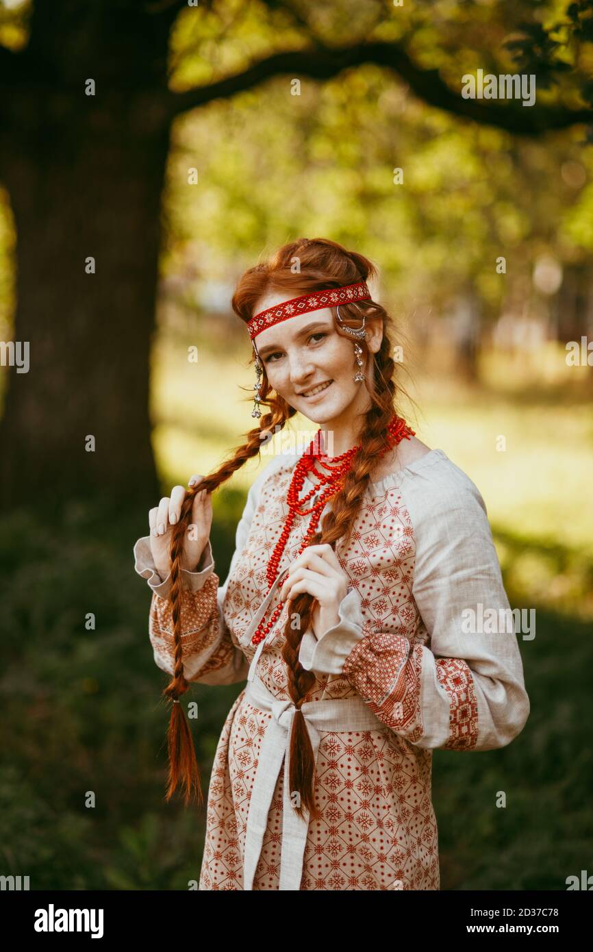 Beautiful Slavic girl with long blonde hair and brown eyes in a white ...