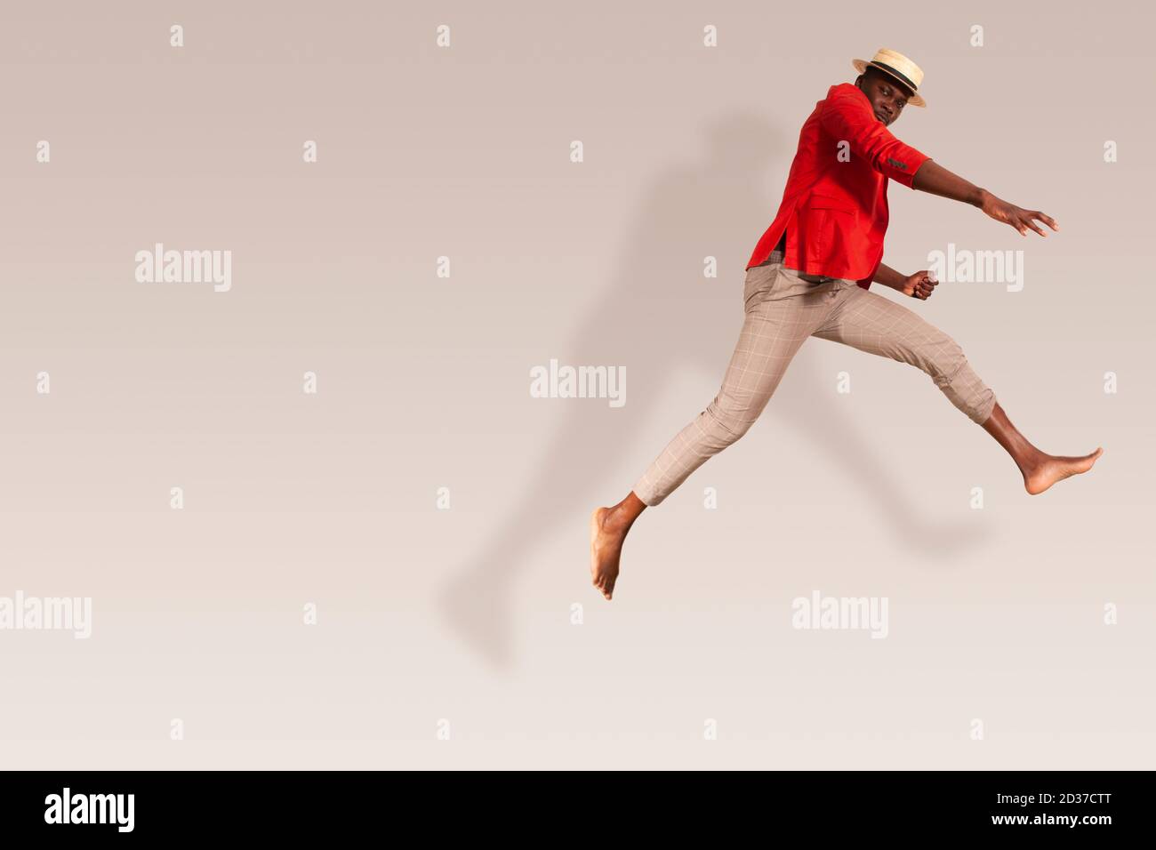 Black african model jumping hi-res stock photography and images - Alamy