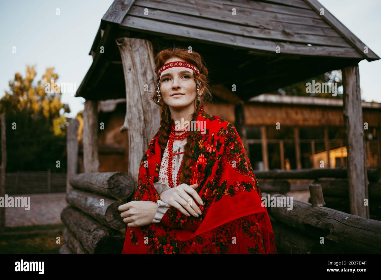 A beautiful Slavic girl with long blonde hair and brown eyes in a white ...