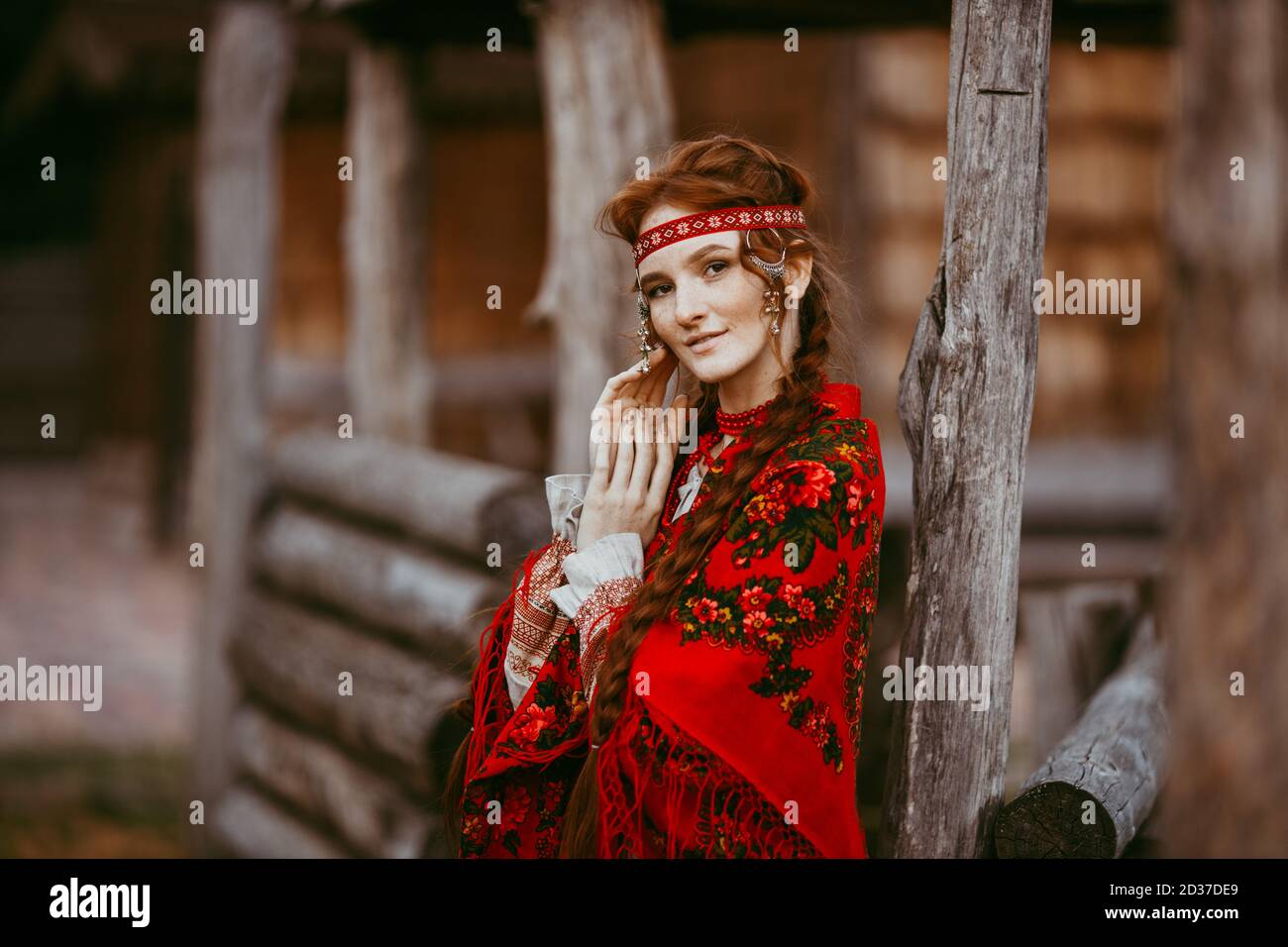 A beautiful Slavic girl with long blonde hair and brown eyes in a white ...