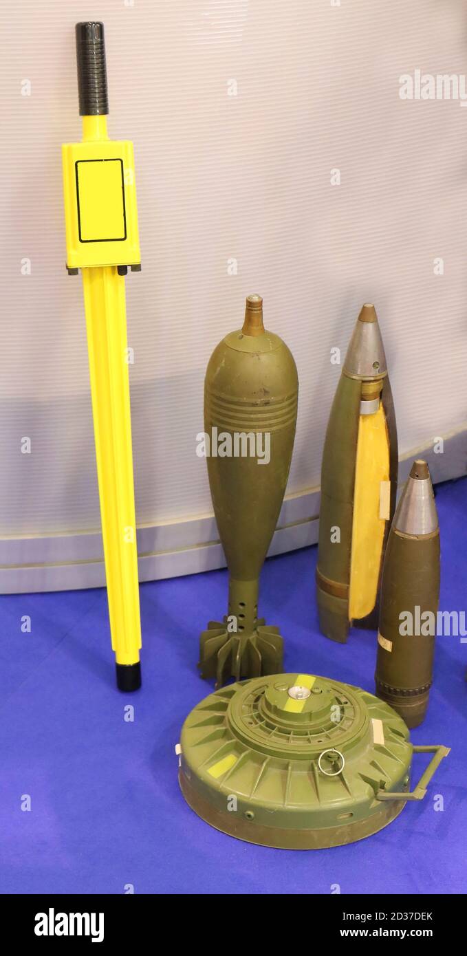 Old land mine bombs on blue carpet interior Stock Photo - Alamy