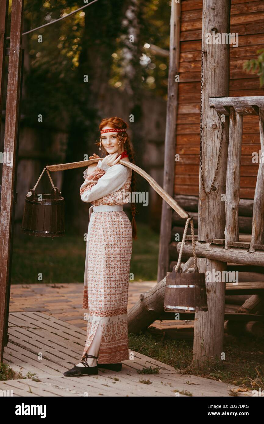 Beautiful Slavic girl with long blonde hair and brown eyes in a white ...