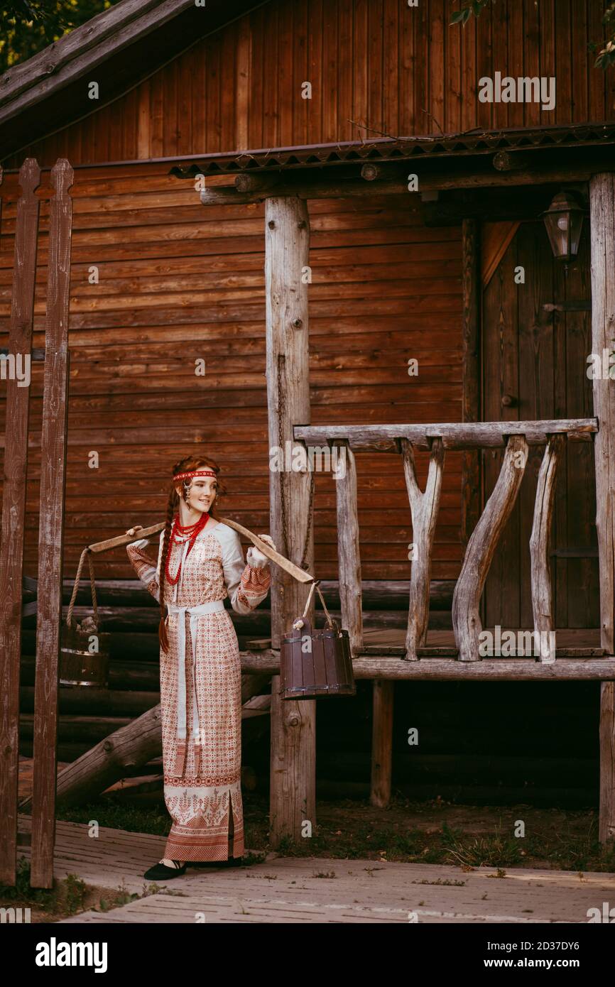 Beautiful Slavic girl with long blonde hair and brown eyes in a white ...