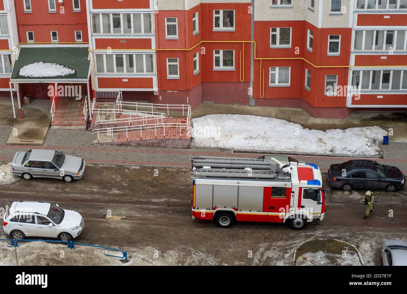 Fire engine in the courtyard of a multi-storey residential building in ...