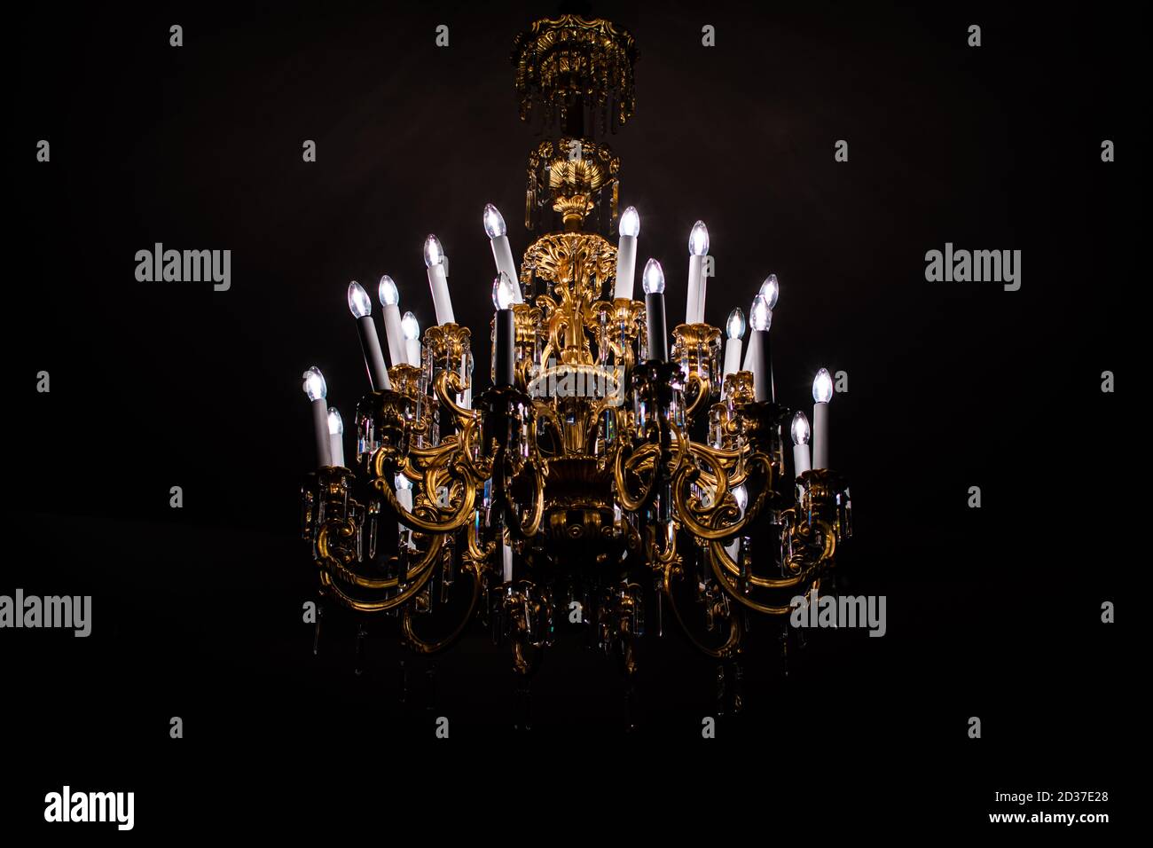 Classic chandelier isolated on black background lighten up Stock Photo ...