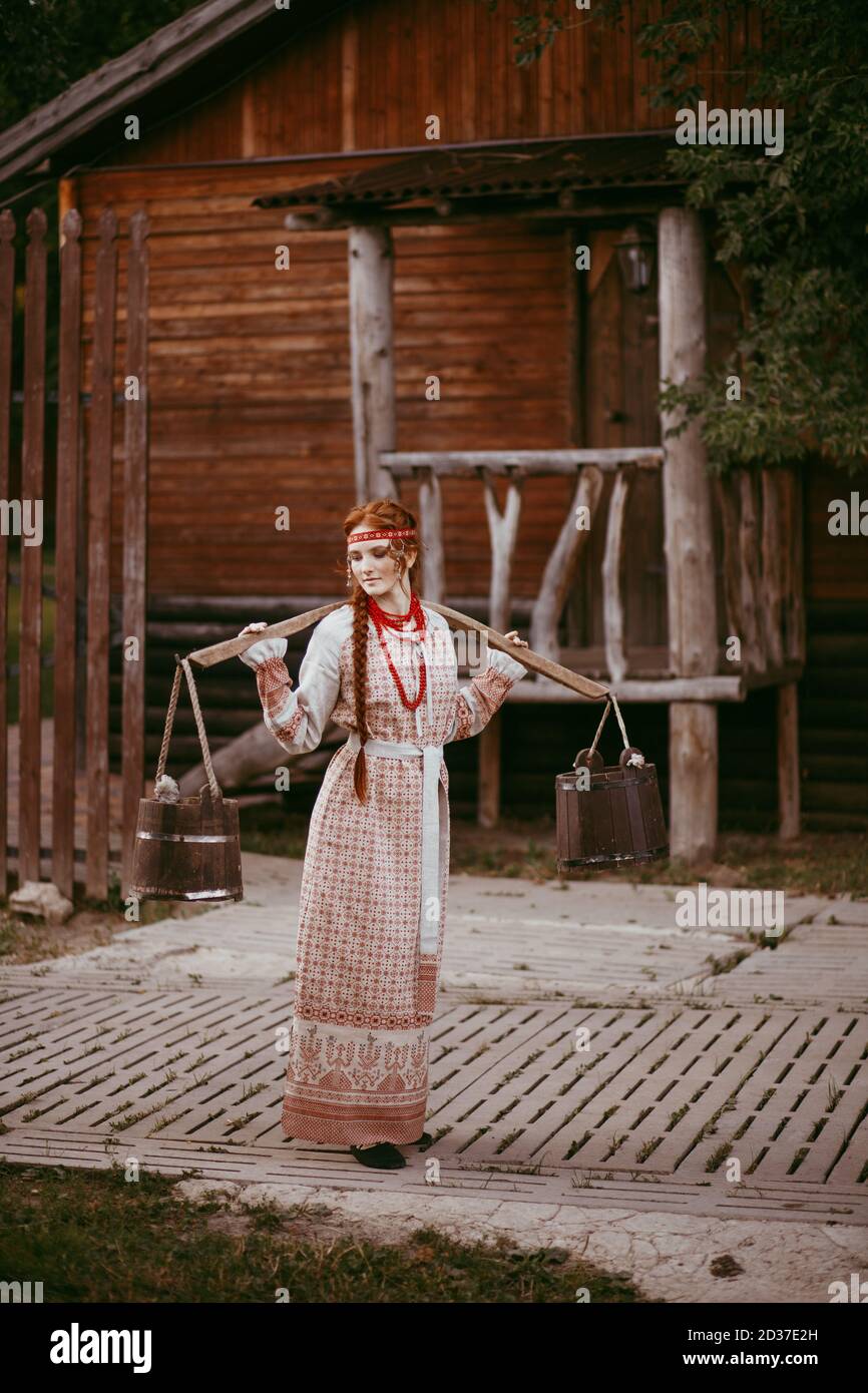 Beautiful Slavic girl with long blonde hair and brown eyes in a white ...