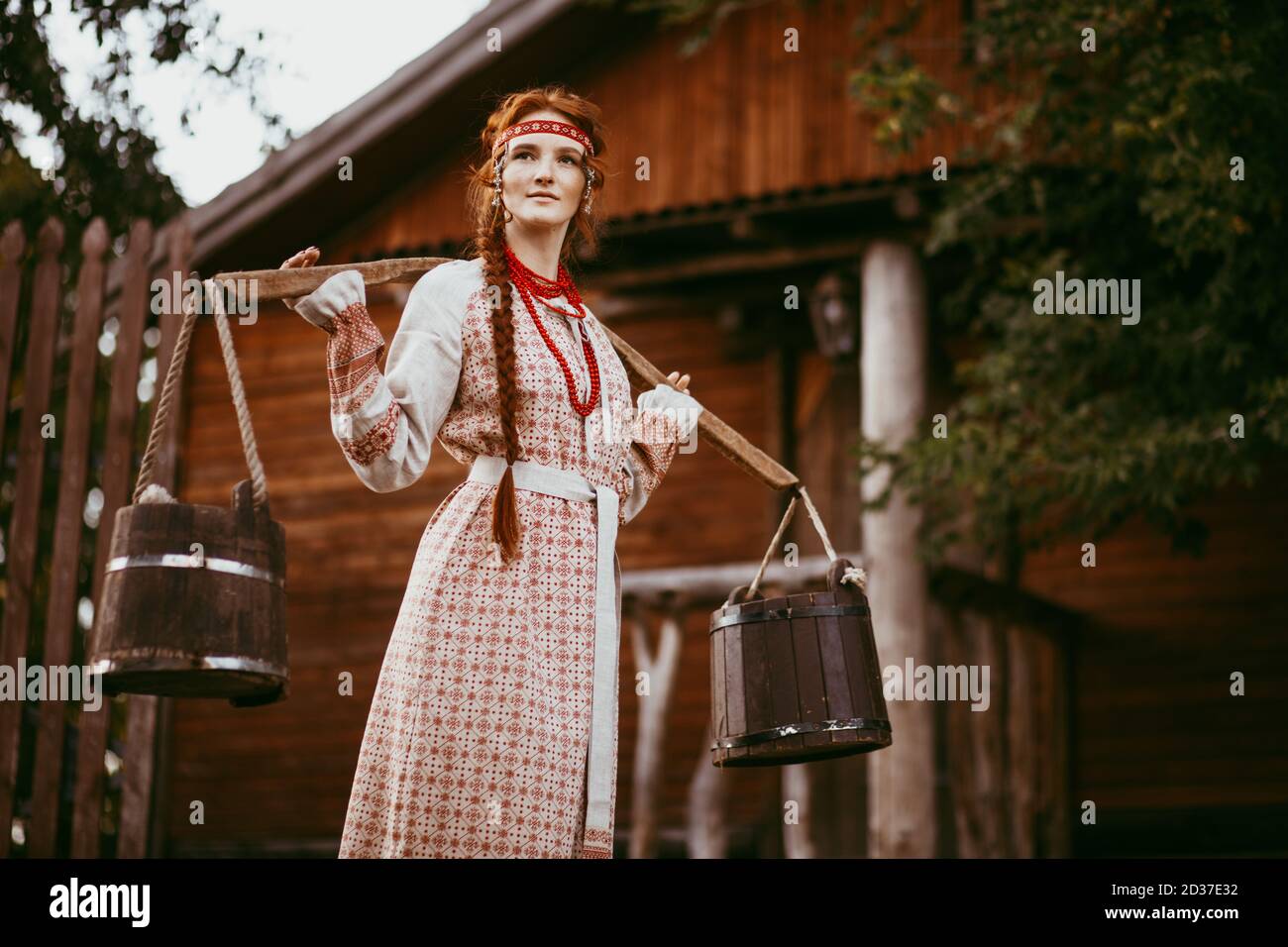 Beautiful Slavic girl with long blonde hair and brown eyes in a white ...