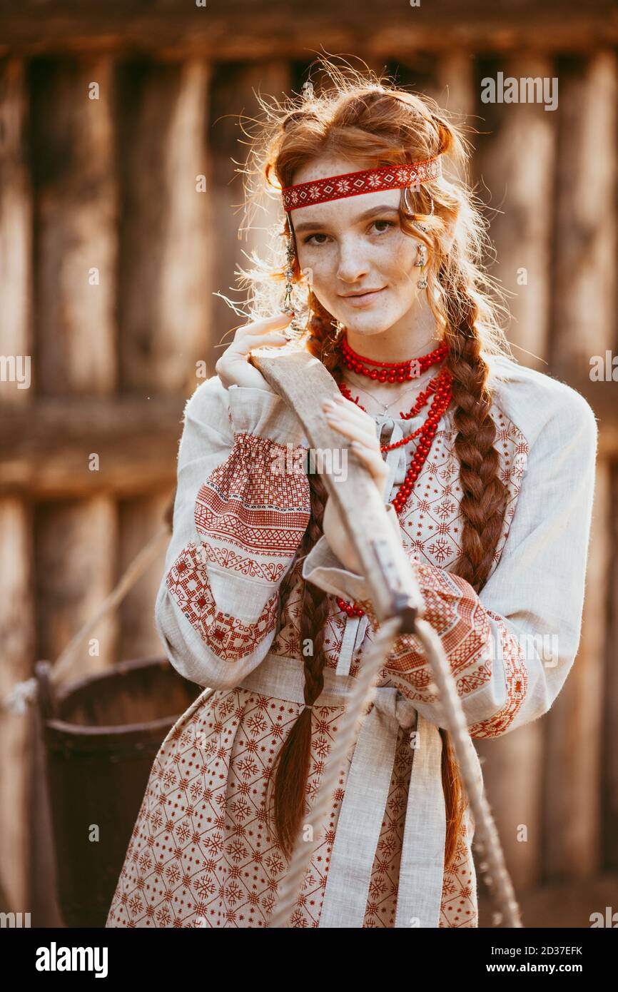 Beautiful Slavic girl with long blonde hair and brown eyes in a white ...